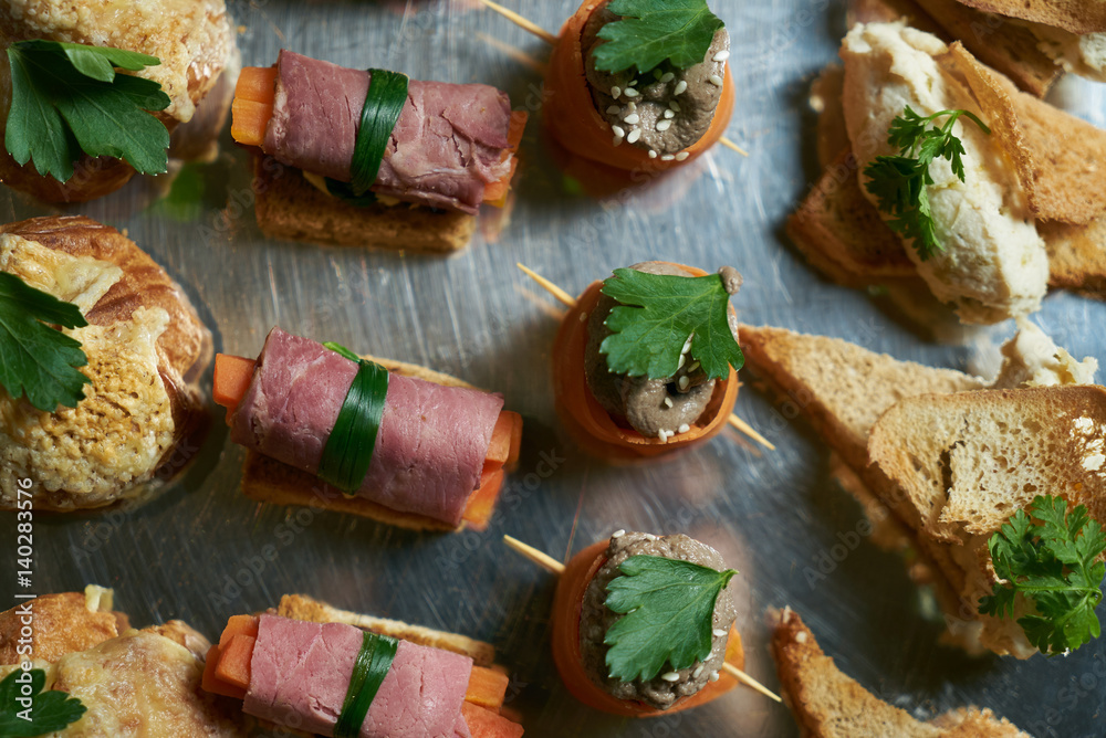 Catering service buffet plate with canapes and appetizing sandwiches on ...