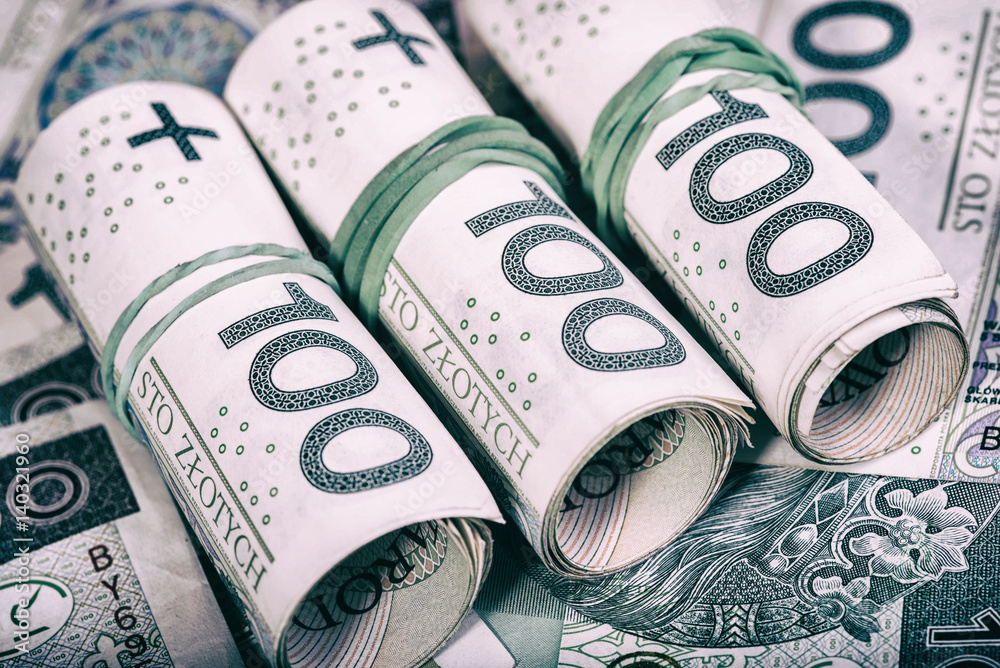 Polish currency PLN, money. File roll of banknotes of 100 PLN (P Stock ...