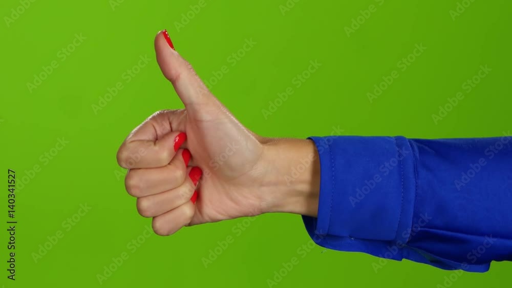 Hand showing thumbs up on green screen background. Sign language Stock ...