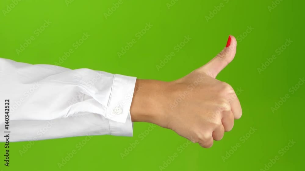 Sign language. Hand showing thumbs up on green screen background Stock ...