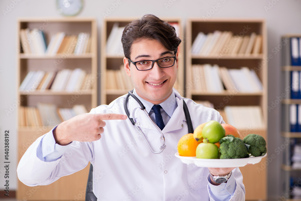 Doctor in dieting concept with fruits and vegetables foto de Stock ...