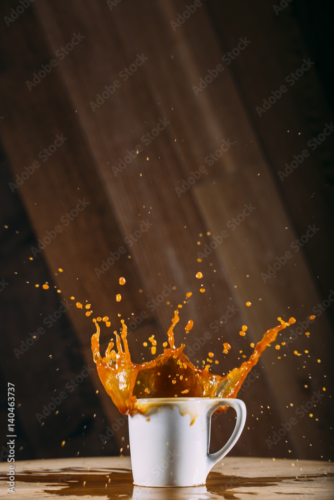 Coffee exploding out of white mug Stock Photo | Adobe Stock