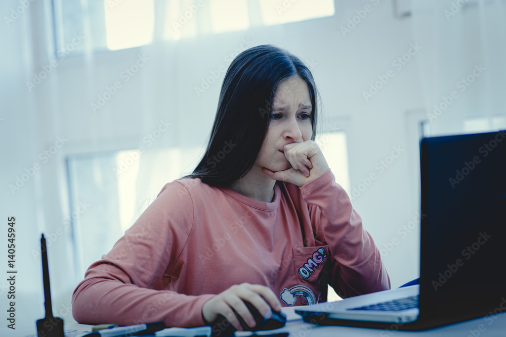 Poster sad and scared female teenager with computer laptop suffering ...