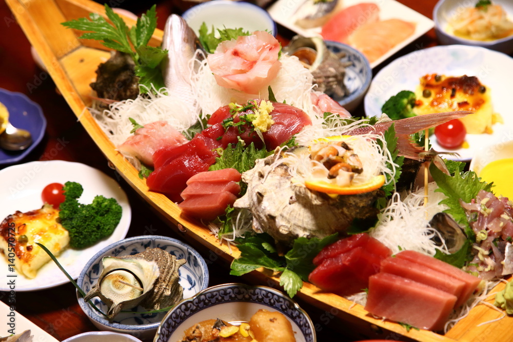 Sashimi boat (assortment of sashimi on a boat) with Japanese ...