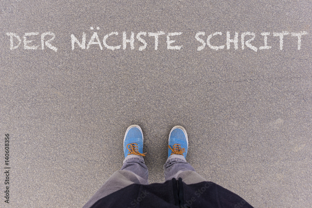 Foto de Der naechste Schritt, German text for Next Step text on asphalt ...