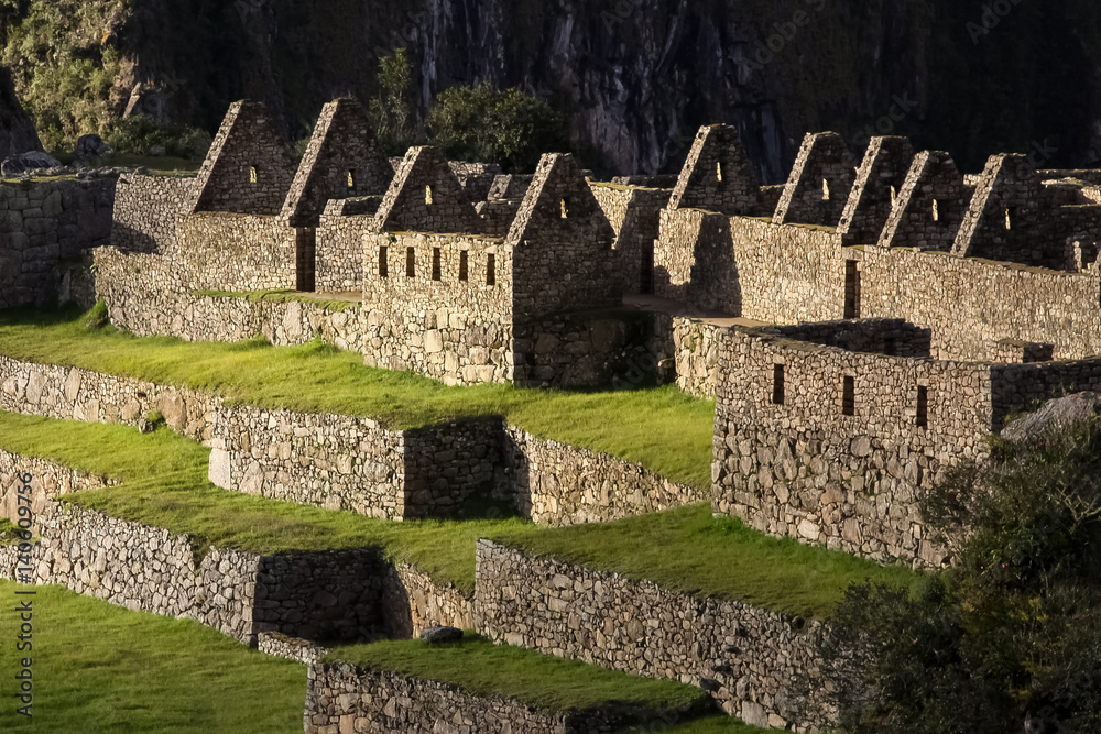 Atmospheric view of typical buildings and terraces in sunlight, Machu ...