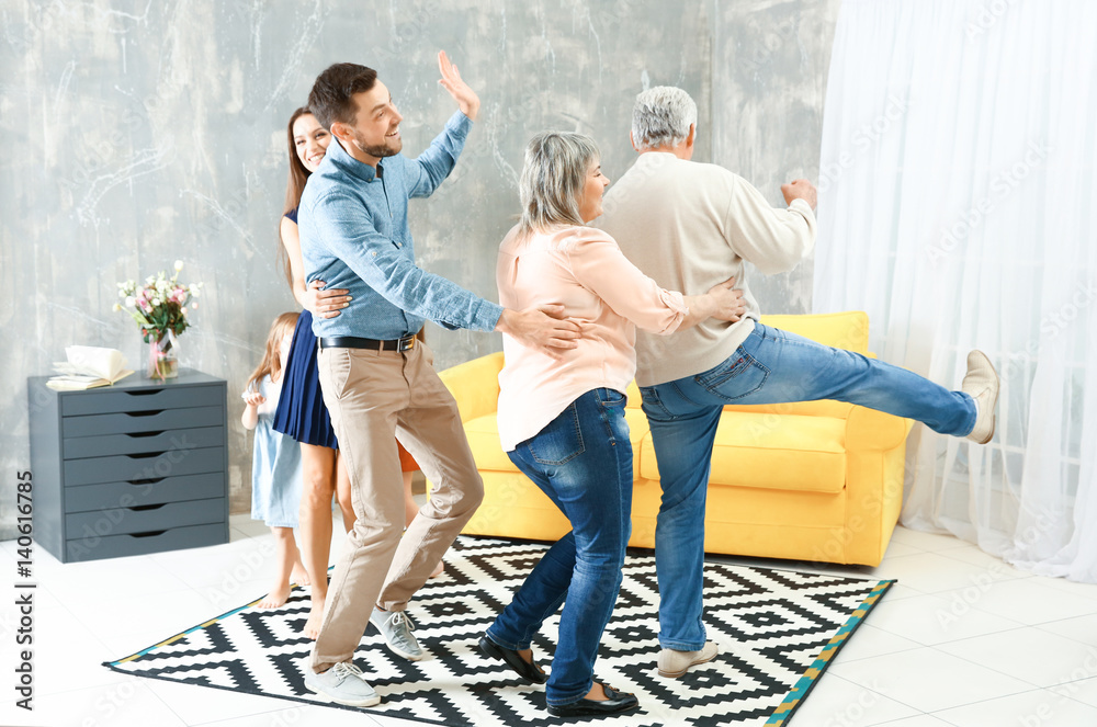 Happy big family dancing in the room Stock Photo | Adobe Stock