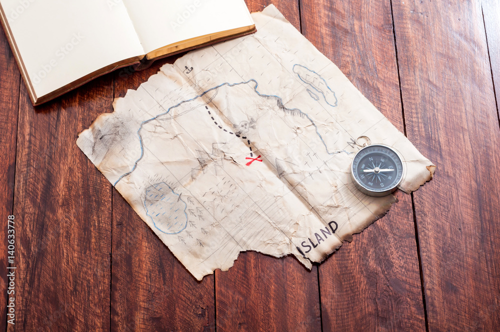 Fake treasure map of pirates wit red cross, compass and empty diary on ...