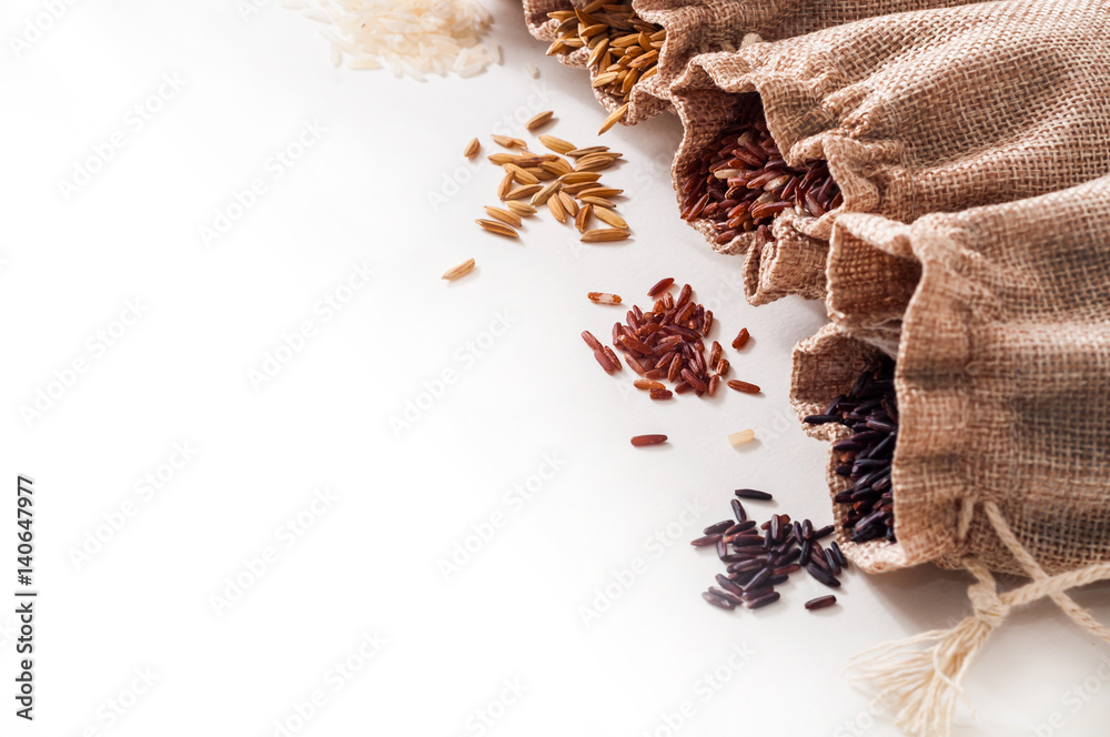 Four different kind of raw rice stored in small burlap sack Stock Photo ...