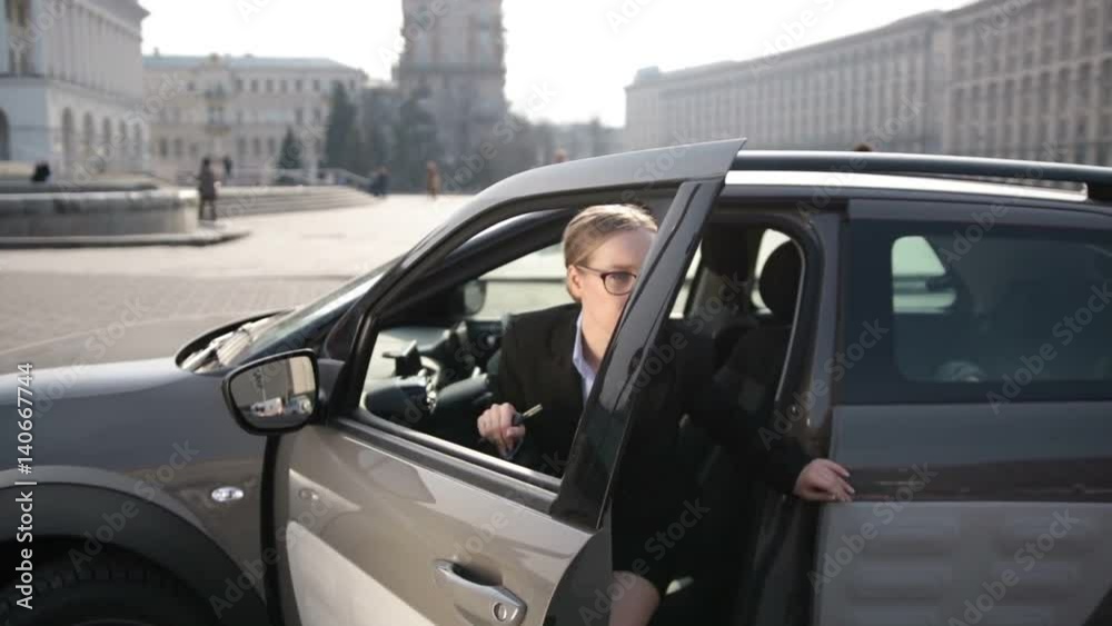 Determined business lady stepping out of car Stock Video | Adobe Stock