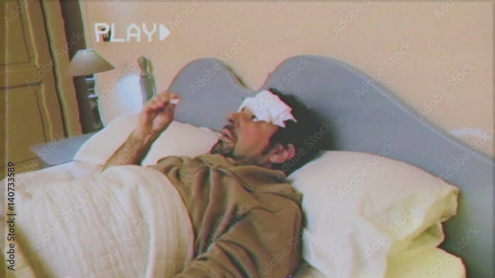 Fake VHS tape: a man lies in the bed, he's got a bad flu / cold ...