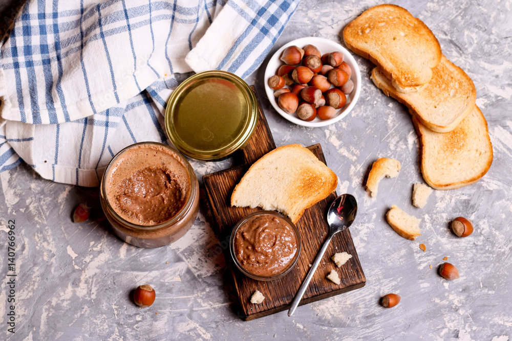 Chocolate paste spread with hazelnuts and bread for breakfast Stock ...
