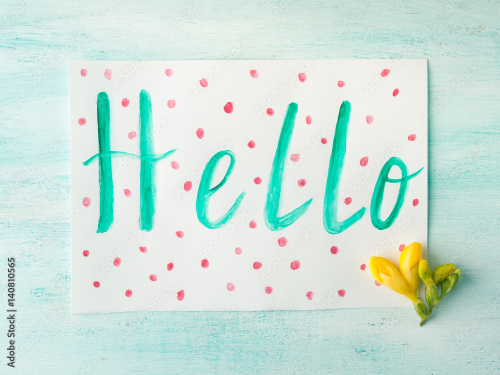 Hello word spelling by watercolor hand lettering yellow flowers. Spring ...