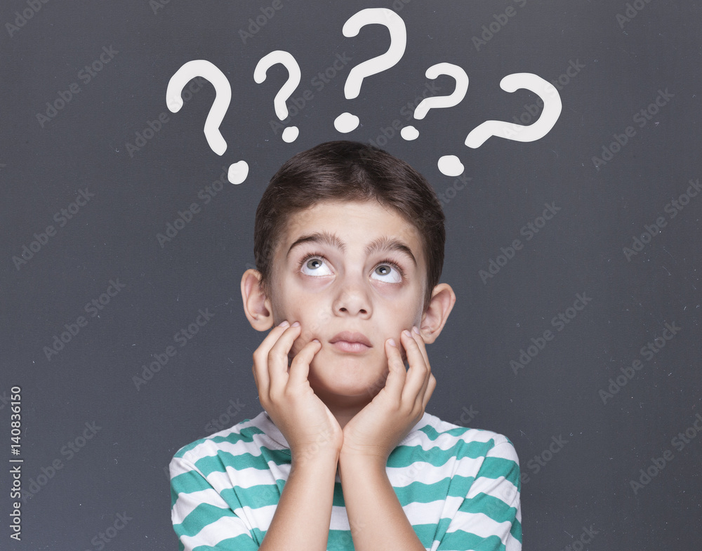 Boy with question marks over his head. Dilemma and decision making ...