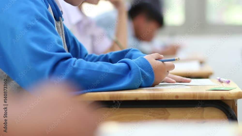 Asian group of young students and girl hands of student writing during ...