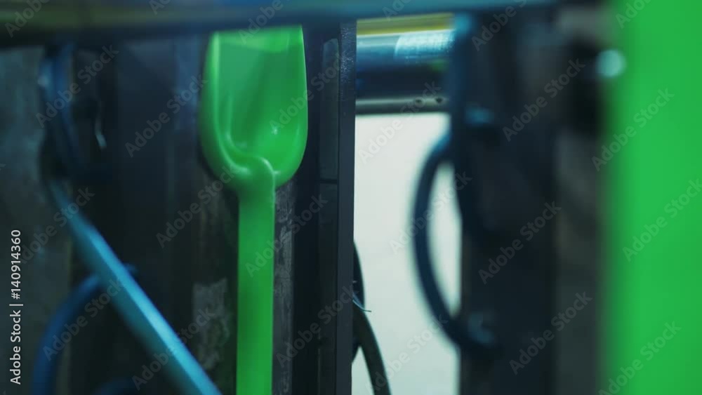 Process of press making plastic parts from the mold. Children's plastic ...