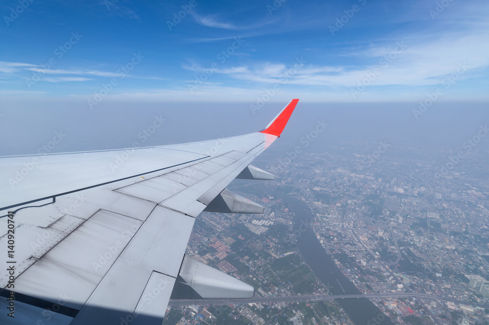 Clouds and sky as seen through window of an aircraft. Looking through ...
