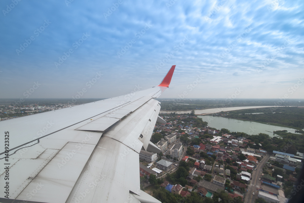 Clouds and sky as seen through window of an aircraft. Looking through ...