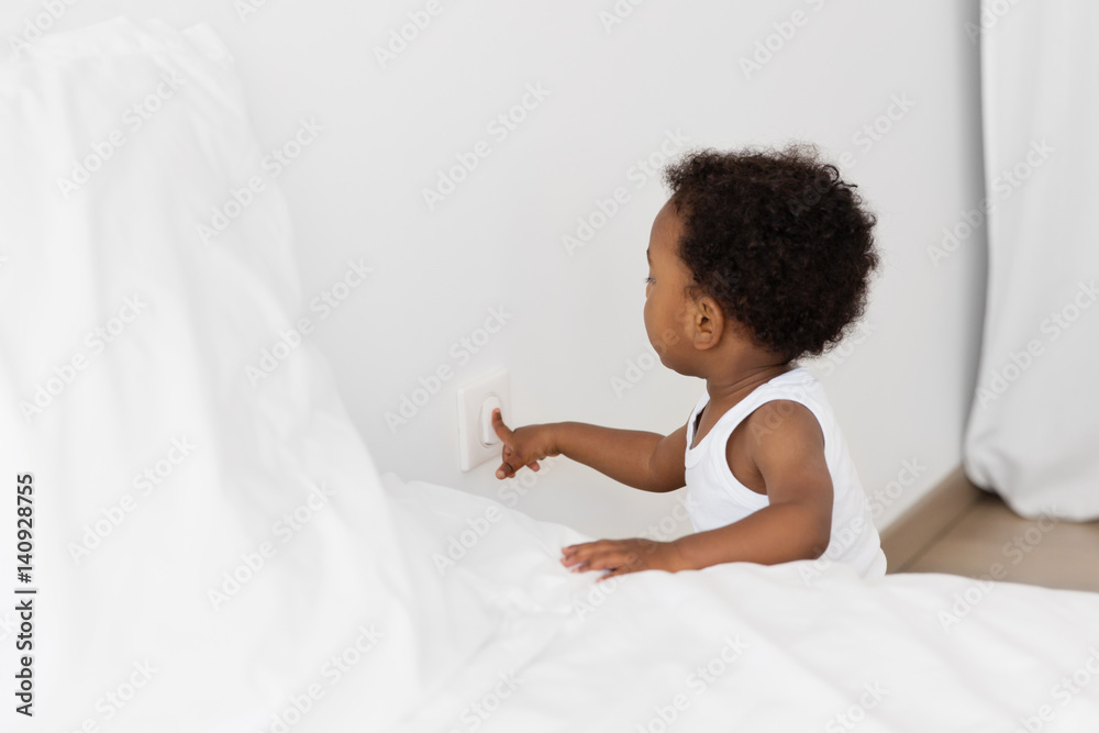 child touching the light switch with his finger Stock Photo | Adobe Stock
