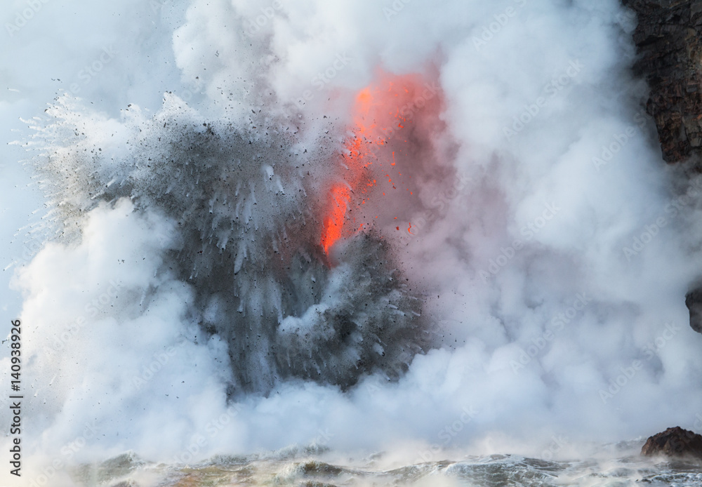 Lava explodes on entry into sea water at the Big Island of Hawaii ...