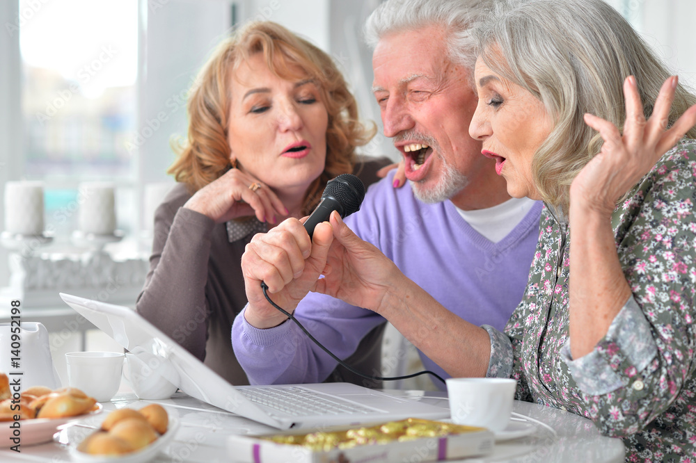 Elderly people singing karaoke Stock Photo | Adobe Stock