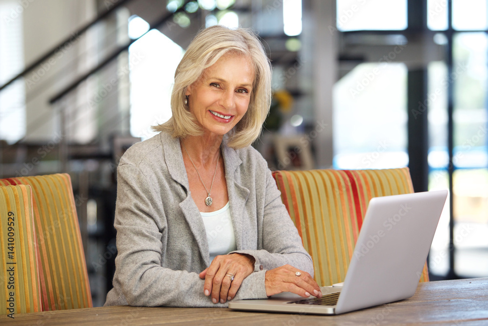 beautiful older woman working laptop computer inside Stock Photo ...
