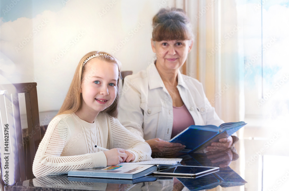 10 years old girl and her teacher. Little girl study during her private ...