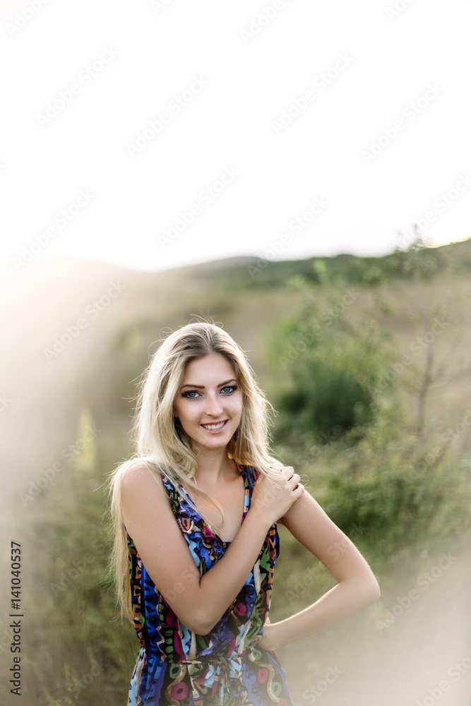 Beautiful Dreamy Blonde Girl With Blue Eyes In A Light Turquoise Dress