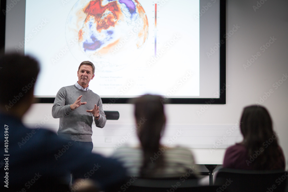 Teacher giving lecture at college Stock Photo | Adobe Stock
