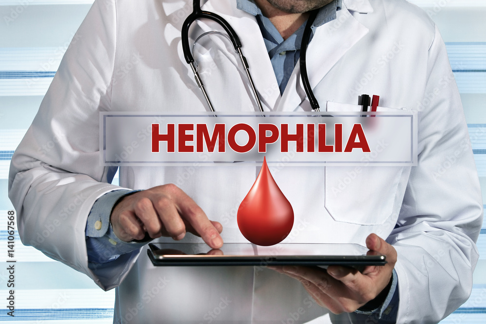 doctor working with tablet in hands in the lab with message hemophilia ...