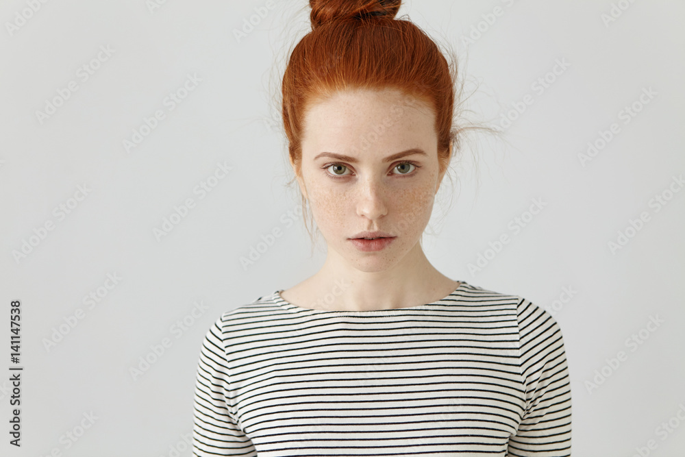 Portrait of gorgeous young female with clean healthy skin with freckles ...