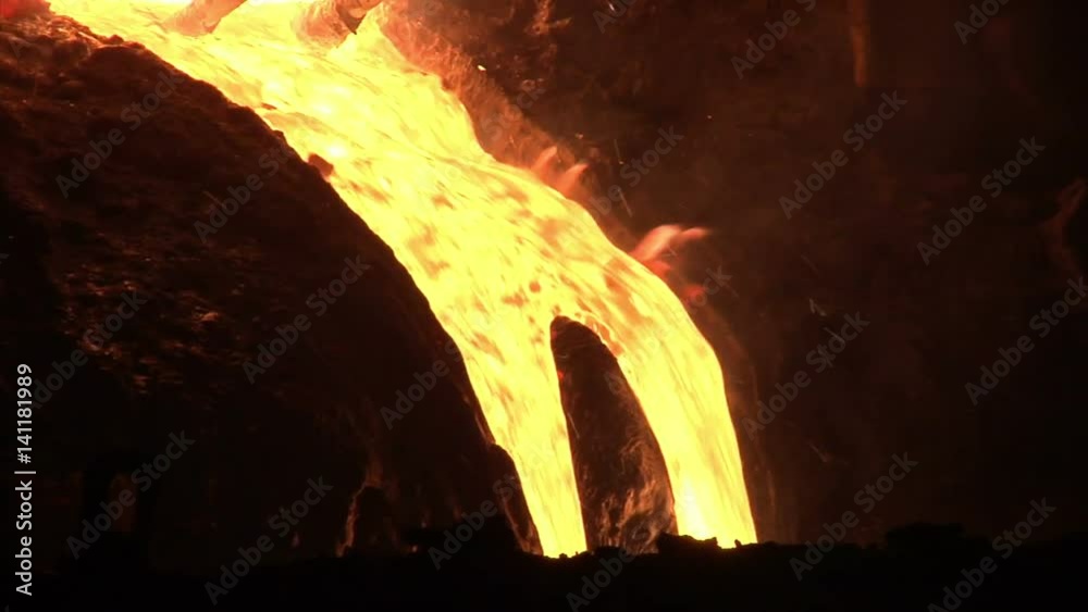 Hot metal pout out from blast furnace. Liquid metal pouring from blast ...