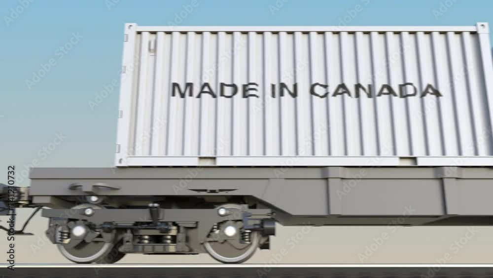 Moving cargo train and containers with MADE IN CANADA caption. Railway ...