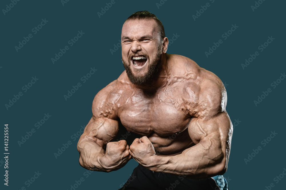 Handsome fit caucasian muscular man flexing his muscles in gym Stock ...