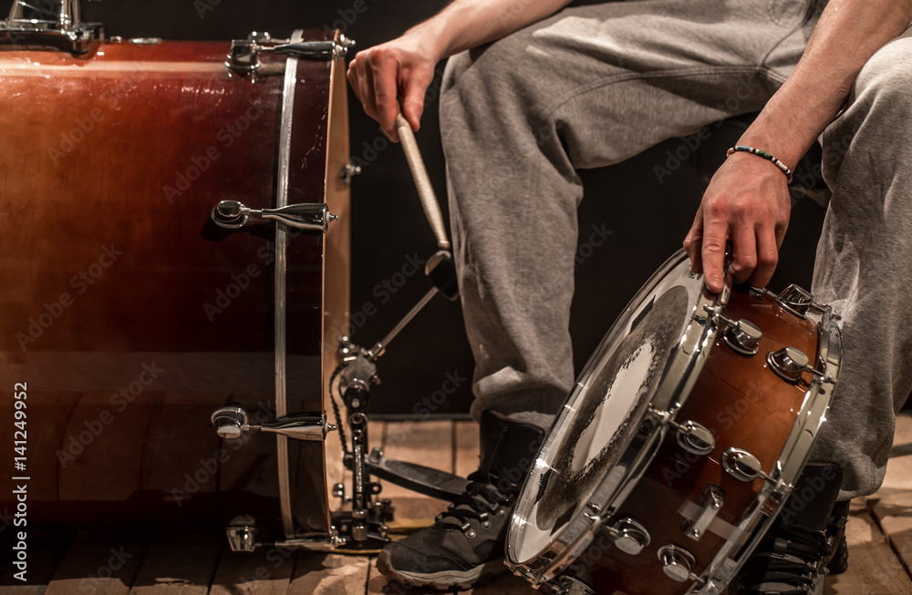 man adjusts percussion instruments, creative music concept Stock-Foto ...