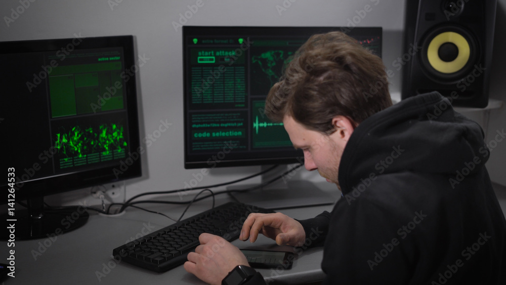 Computer room in the basement. A man checks the information on your ...