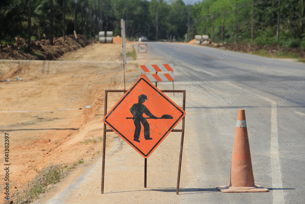 Road signs warning about the repair of the road. ภาพถ่ายสต็อก | Adobe Stock
