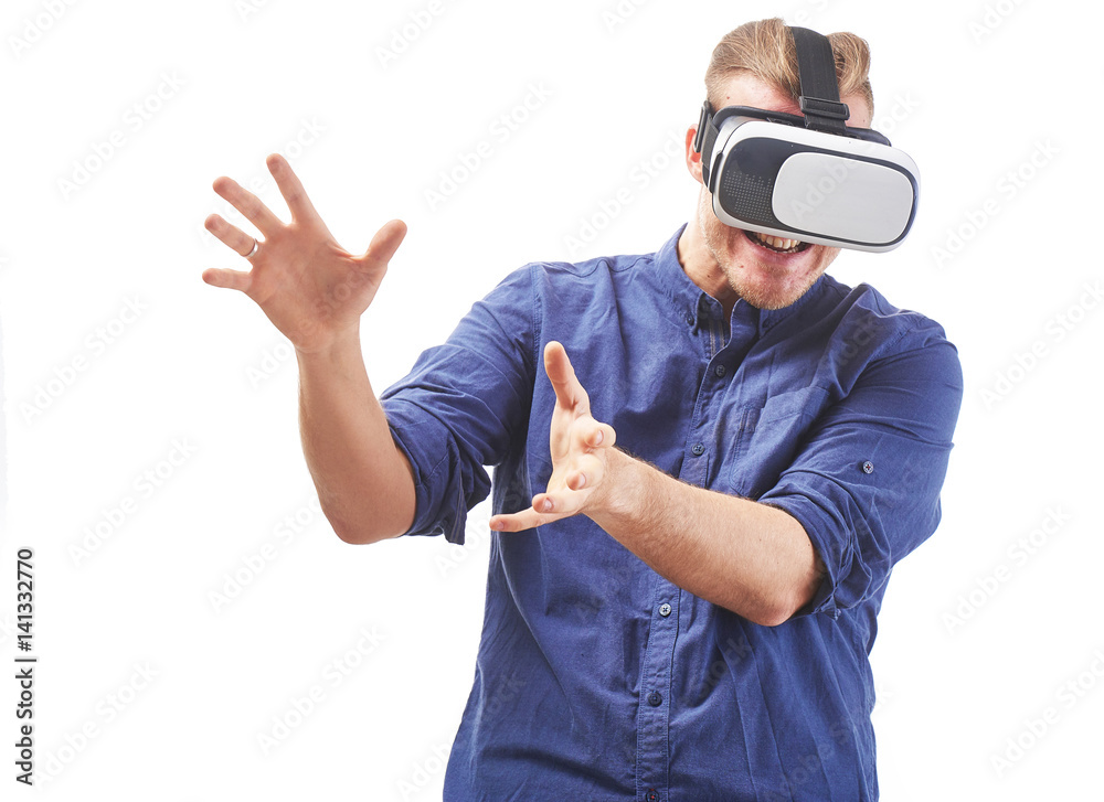 Screaming young man using a VR headset enjoying interactive game with ...