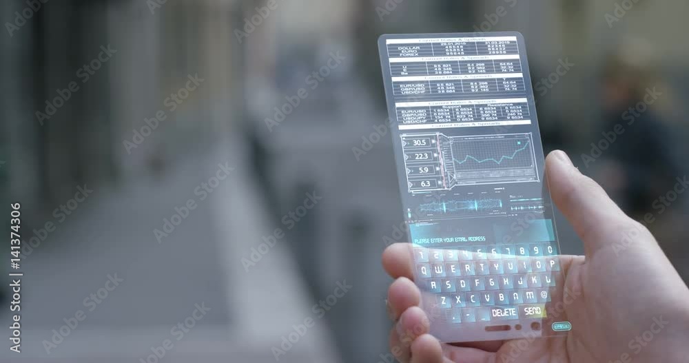A businessman in the city, use the transparent phone with latest ...