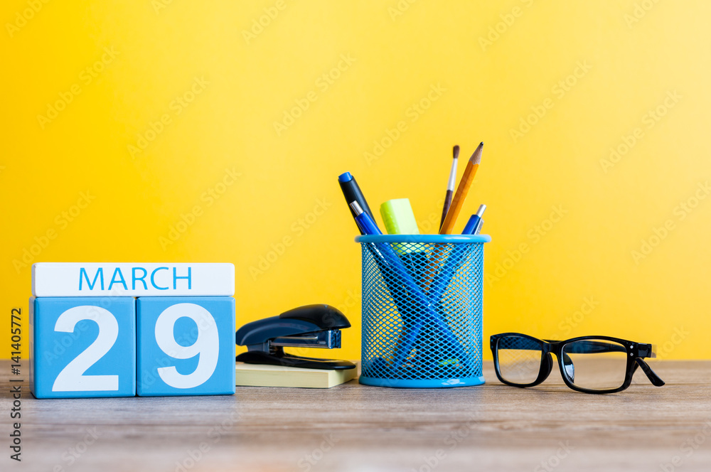 March 29th. Day 29 of month, calendar on light yellow background ...