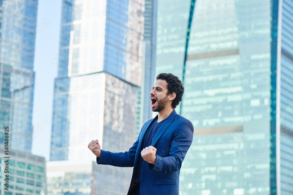 Luckiest guy in the jacket the background of skyscrapers and glass ...