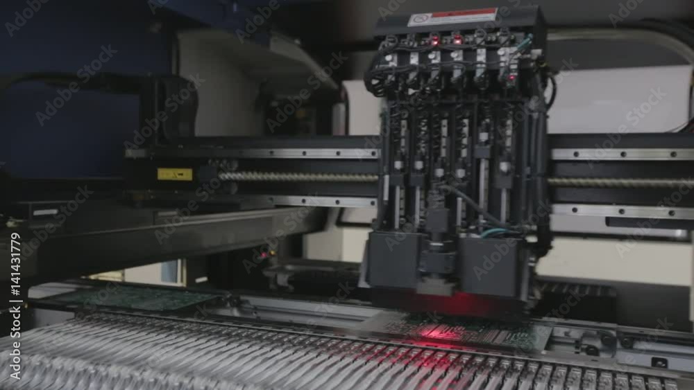 Automated Electronic circuit board production. Machine Produces Printed ...