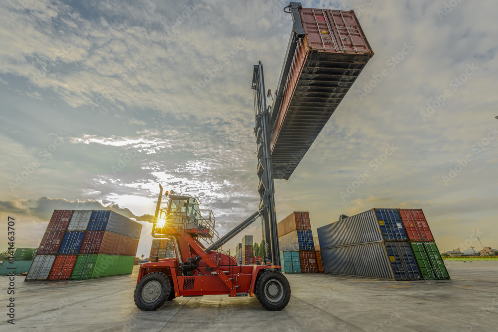 stacker forklift working on lifting unit of containers in yard Stock ...