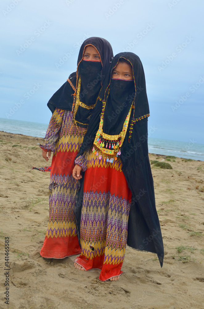 Young girls in traditional dress of nomad family of the Rashaida ...
