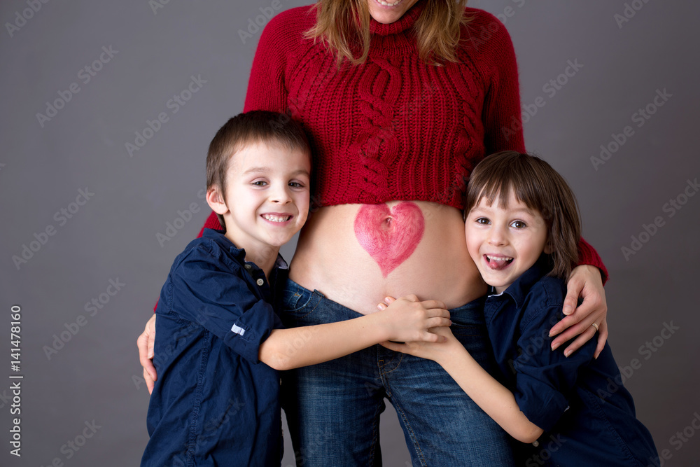 Beautiful preschool children, hugging their pregnant mom Stock Photo ...