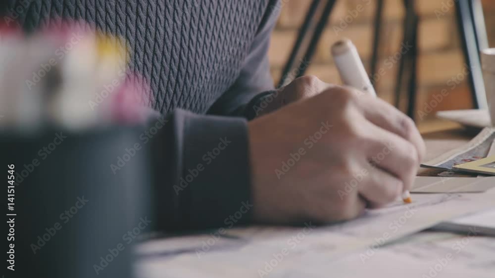 Close-up: the process of drawing. Creating a design project or drawing ...