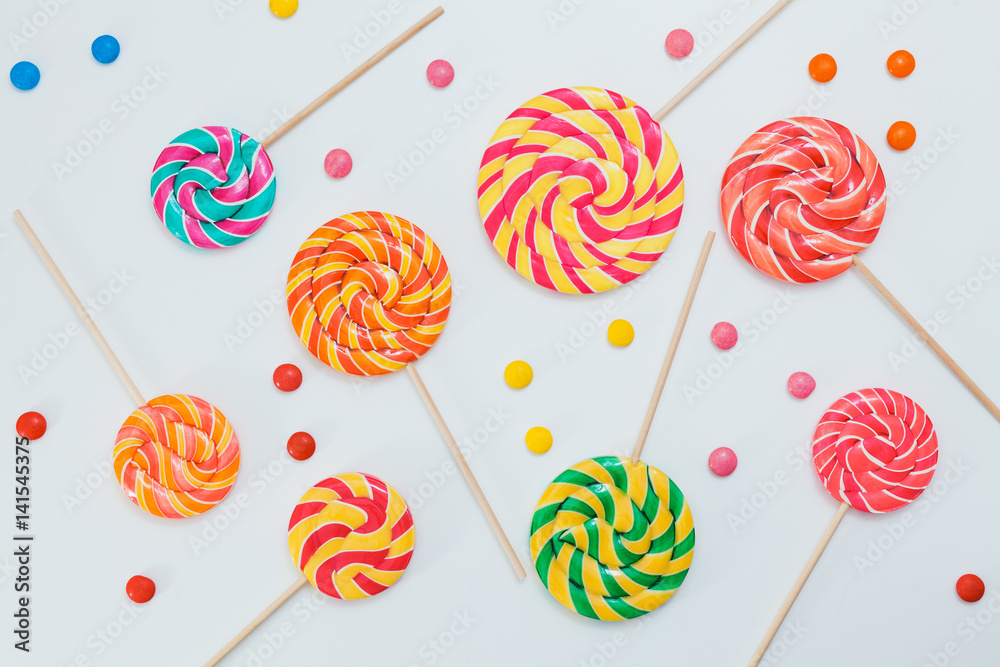 Pattern sweet lollipops, candy on white background, top view flat lay ...