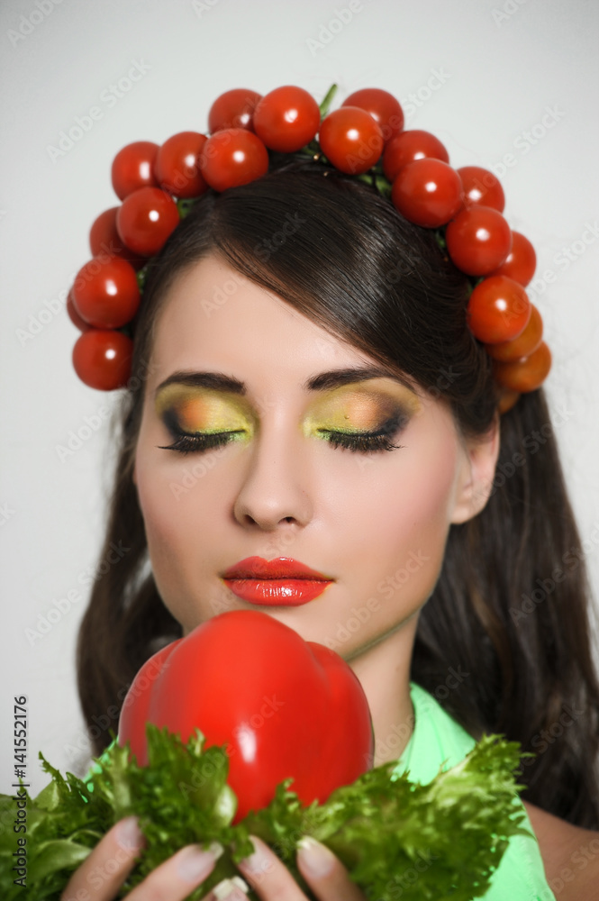 Girl with tomatoes on her head. Can be used for healthy food concept ...