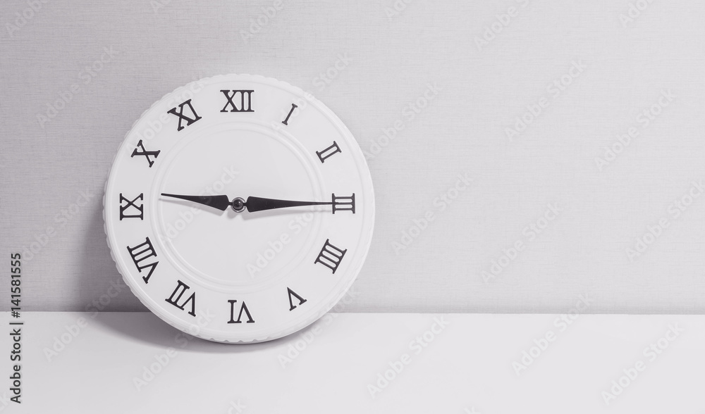 Closeup white clock for decorate show a quarter past nine or 9:15 a.m ...
