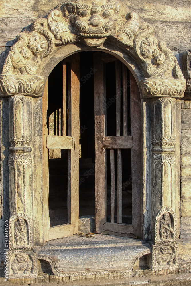 Ornamental stone gate with wooden door, Pashupatinath Temple, Kathmandu ...